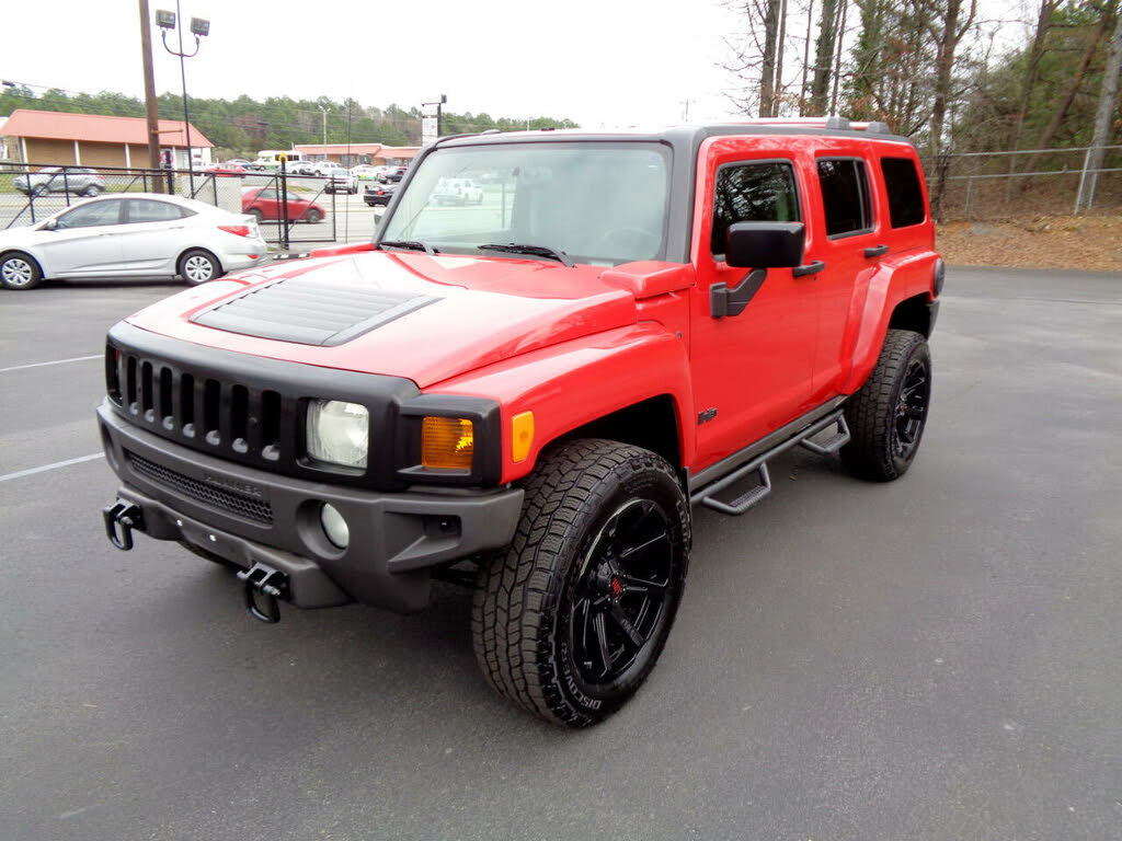 Lifted Red Hummer H3