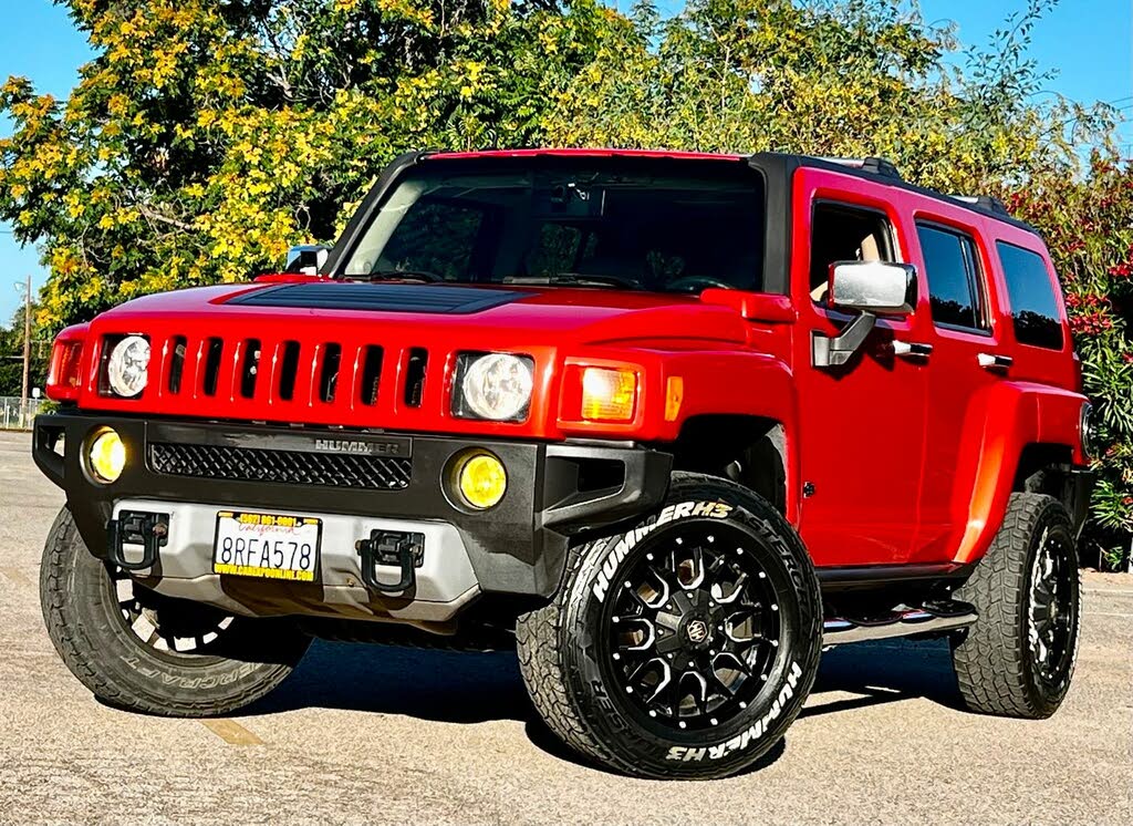 Lifted Red Hummer H3